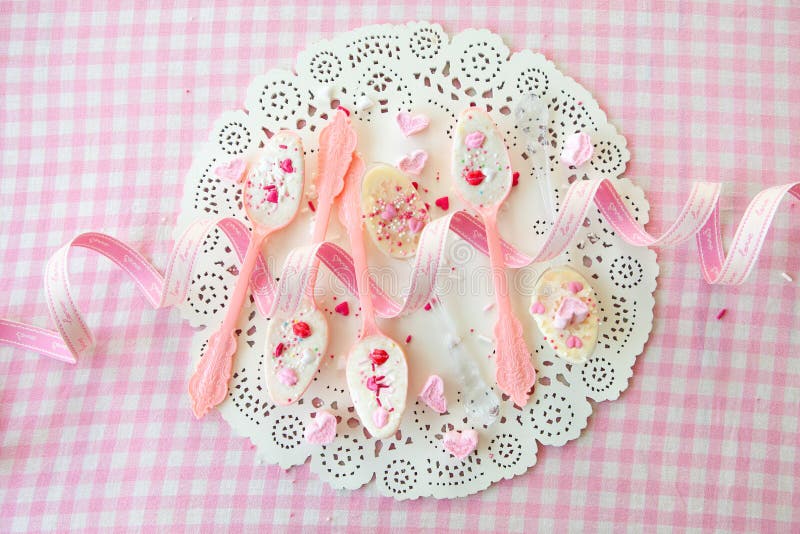 Pink spoons with chocolate stock photo. Image of spoons - 137309448