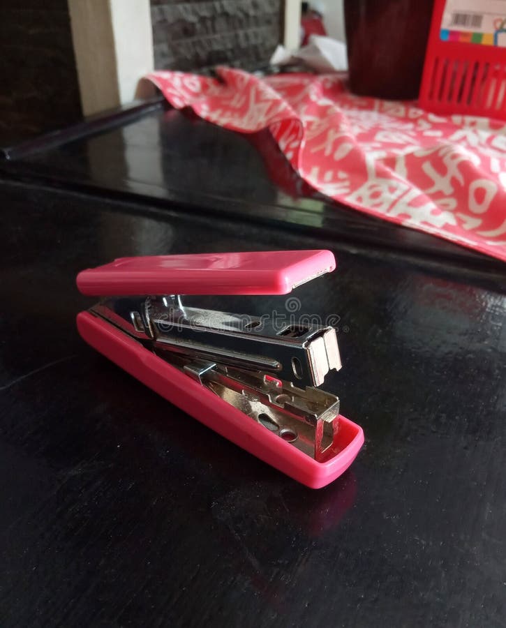 Pink Stapler on the Black Table Stock Photo - Image of manual, iron ...