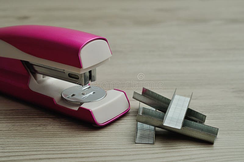 A Pink Stapler with a Pile of Staplers Stock Image - Image of plastic ...
