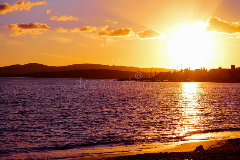 Pink sunset in Fertilia stock photo. Image of horizon - 63639740