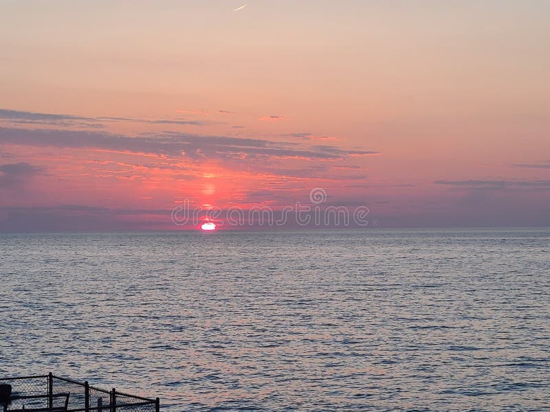 Pink sunset over Lake Erie stock photo. Image of coast - 220557876