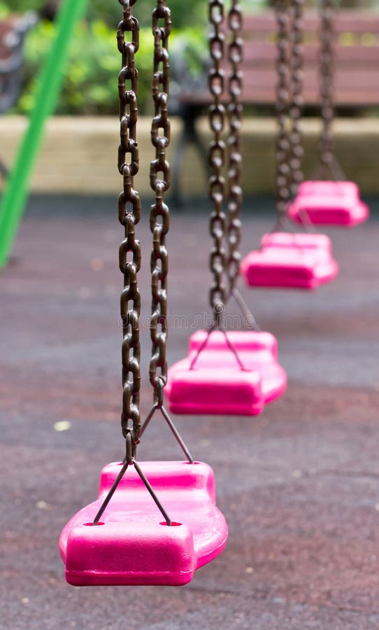 Pink Swing in Playground. stock photo. Image of childhood - 36515982