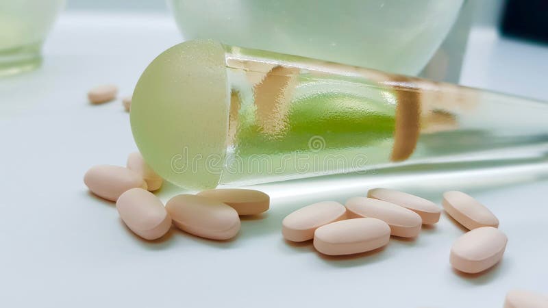 Pink tablets and mortar stock photo. Image of treatment - 129751798