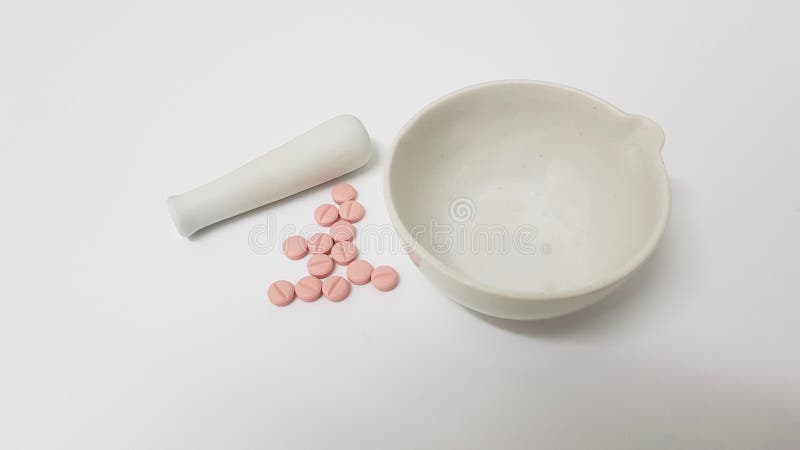 Pink tablets and mortar stock photo. Image of cure, healthcare - 136290216