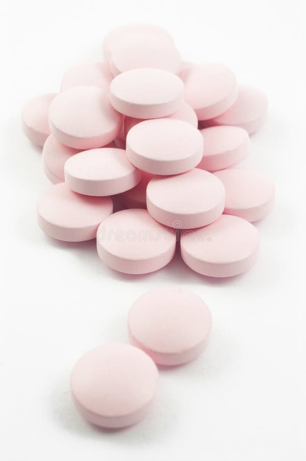 Pink tablets and pills stock image. Image of medicinal - 6392985