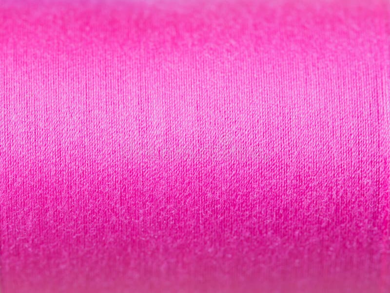 Pink thread roll black stock photo. Image of twisted - 75318378