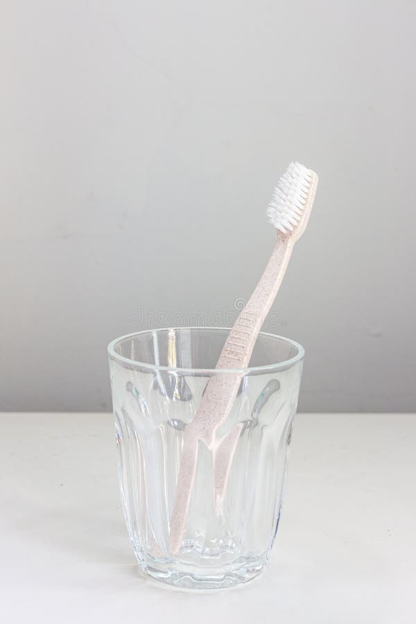 Pink Toothbrush in a Glass Placed on a White Background Stock Image ...