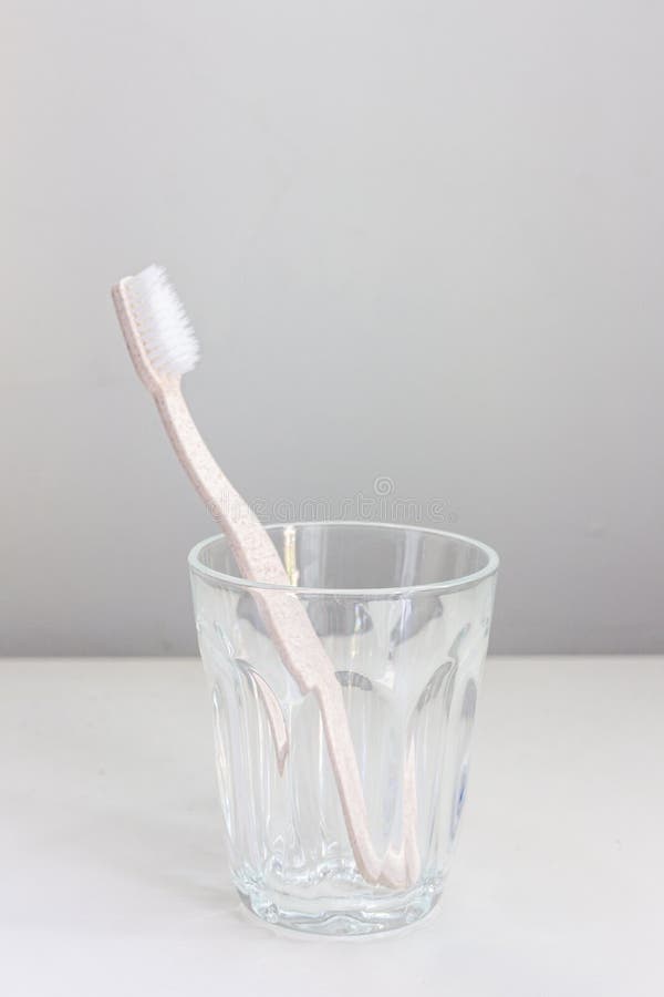 Pink Toothbrush in a Glass Placed on a White Background Stock Image ...