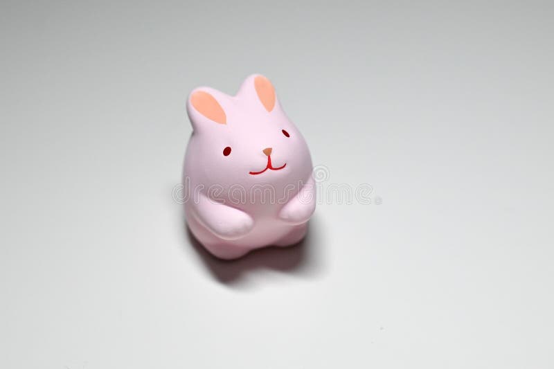 Pink Toy Bunny Figure Sitting on a White Surface Stock Image - Image of ...