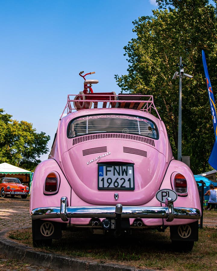 Pink Volkswagen Beetle Car on the Grass. Editorial Photo - Image of ...