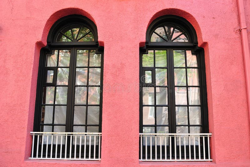 Pink Wall with Windows stock image. Image of gutterpipe - 14148145