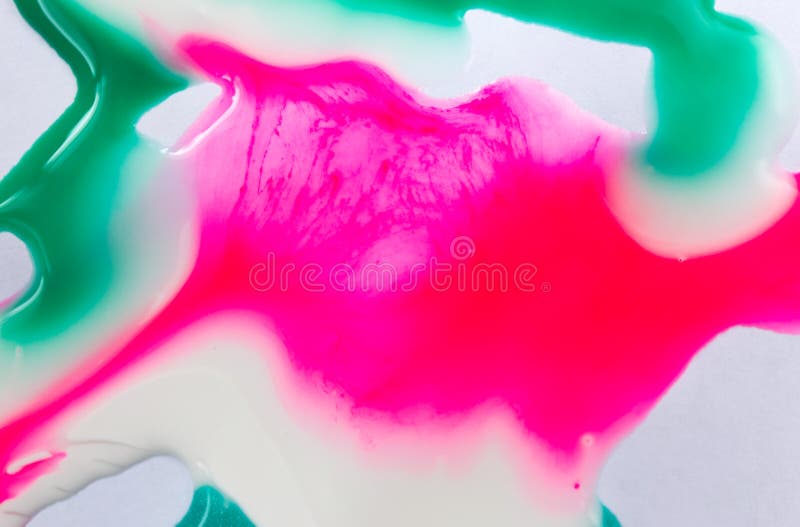 Pink, White and Green Mixed Inks Spilled on White Paper Background with ...