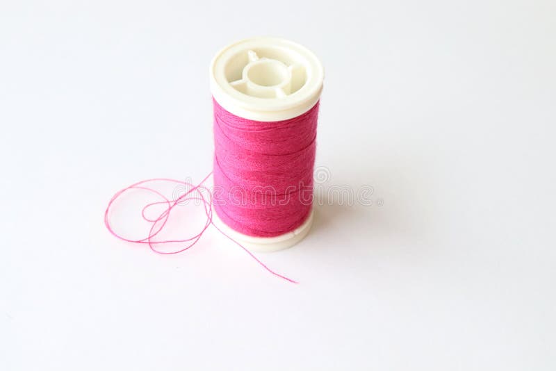 A Pink Wound Spool of Sewing Thread Stock Photo - Image of ground ...