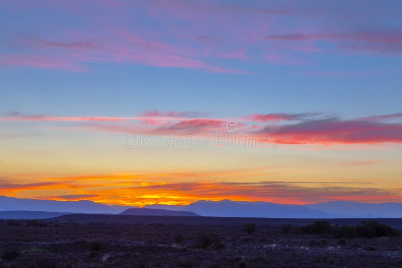 Pink and Yellow Colored Clouds after Sunset in the Karoo Stock Photo ...