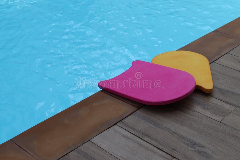 Pink and Yellow Float Foam Board at the Edge of the Pool Stock Photo ...