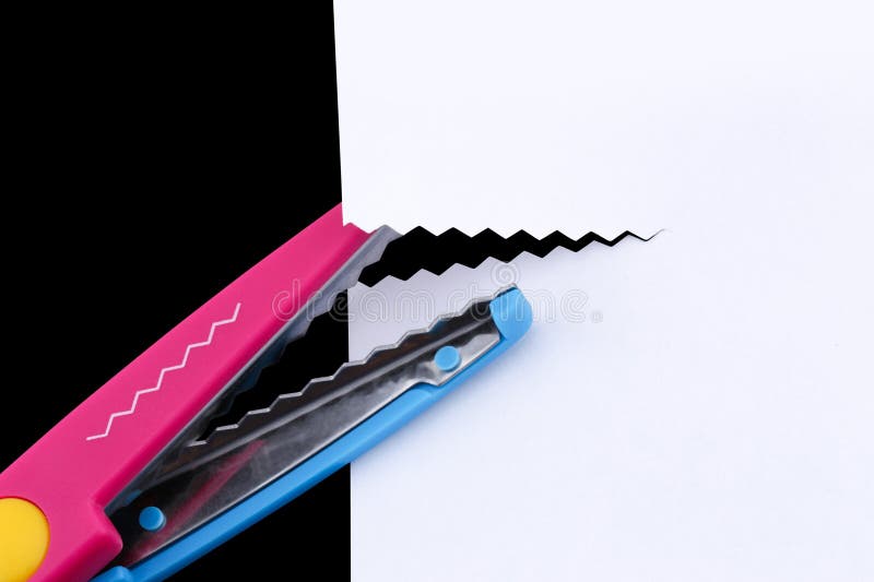 Pinking Shears Cutting a White Piece of Paper Stock Photo - Image of ...