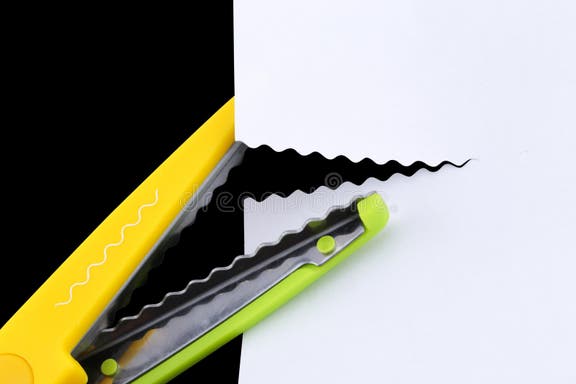 Yellow Green Pinking Scissor Shears Cutting a White Piece of Paper ...