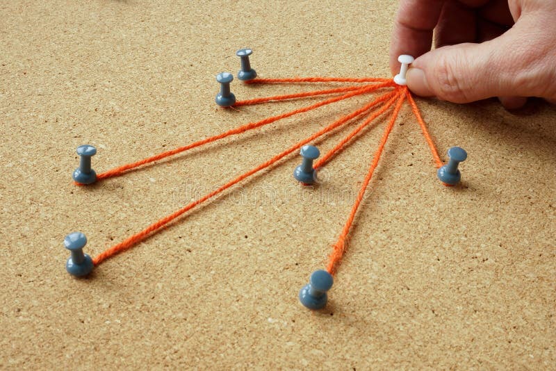 The Pins are Connected by a Thread and the Hand Holds the Main One ...