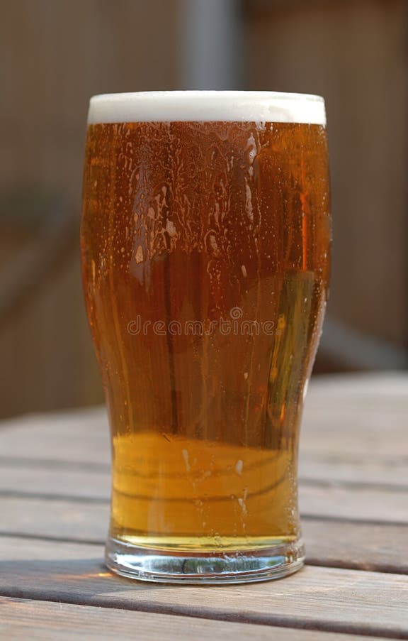 Pint of Ale on Beer Garden Table Stock Image - Image of alcoholic, pint ...