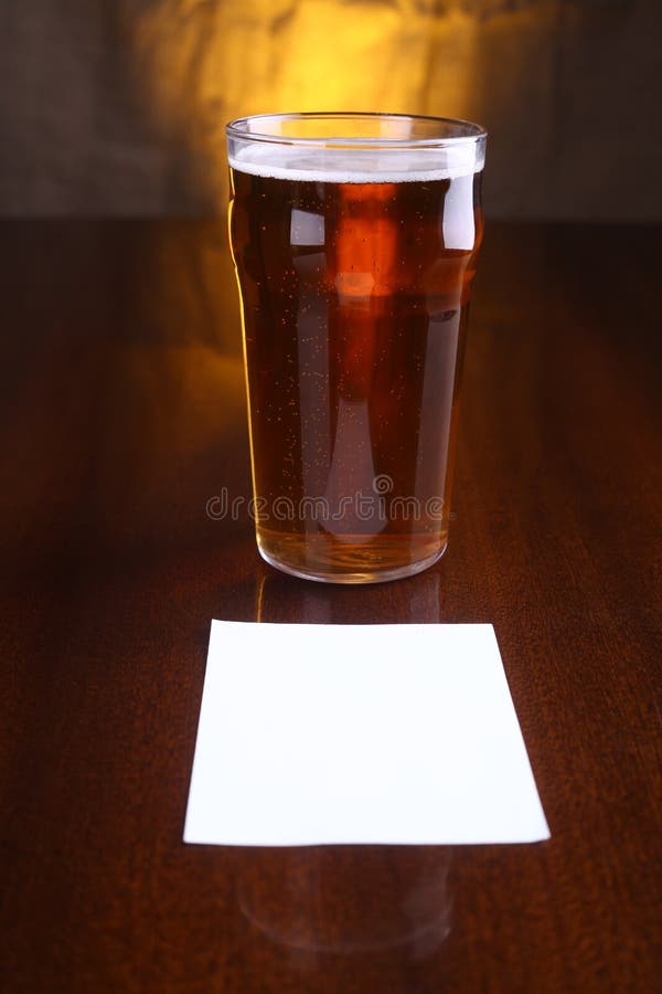 Pint of beer and note stock photo. Image of wood, note - 51617818