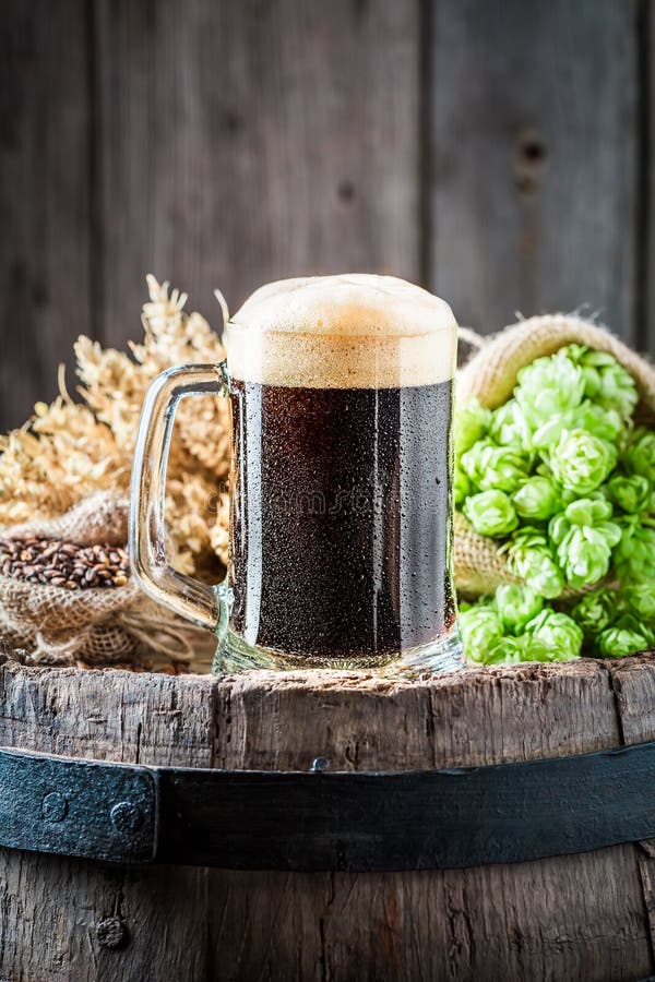 Pint of Dark Beer on Old Oak Barrel Stock Image - Image of foam ...
