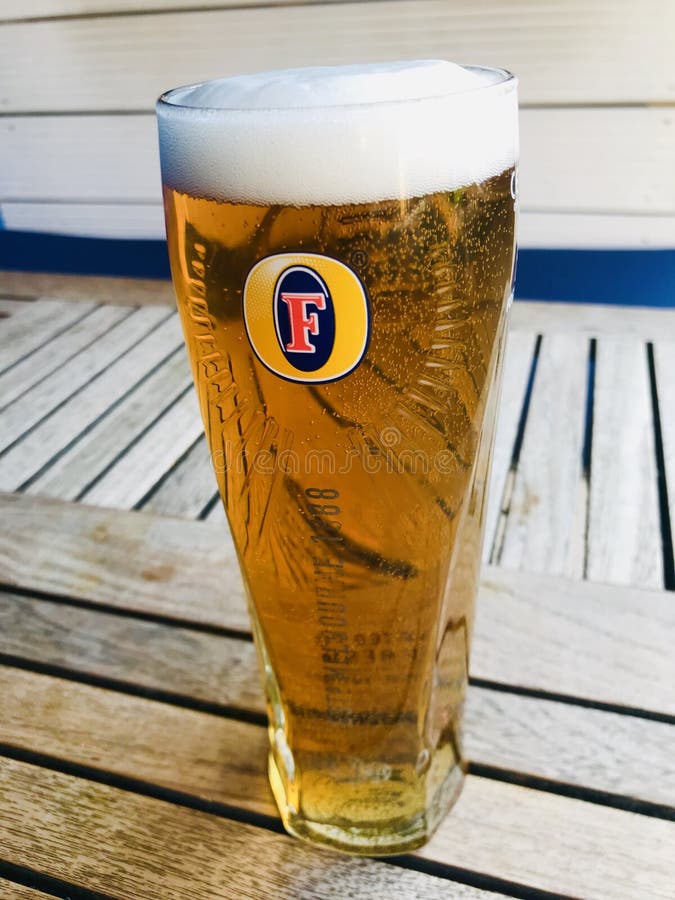 A pint of Fosters editorial stock image. Image of pint - 157021064