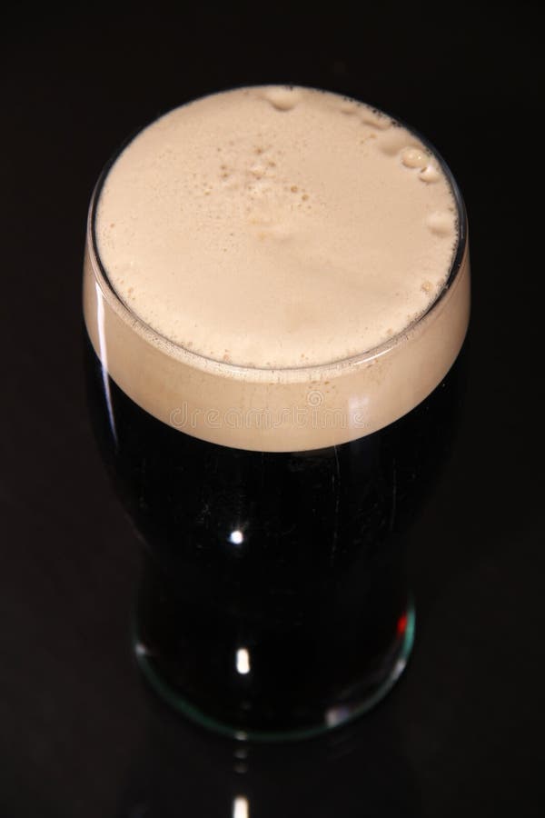 Pint of Stout Beer with Green Shamrock Stock Photo - Image of beer ...