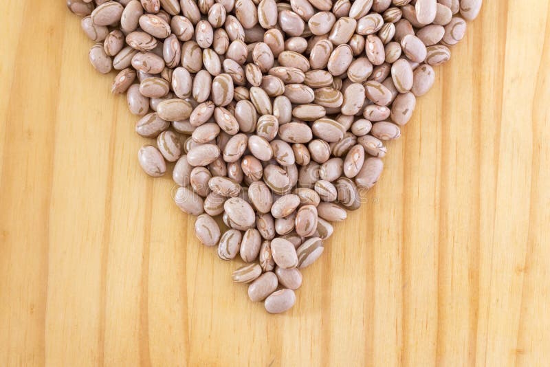 Pinto Beans Um Triangle Shape Over Wooden Table Stock Image - Image of ...