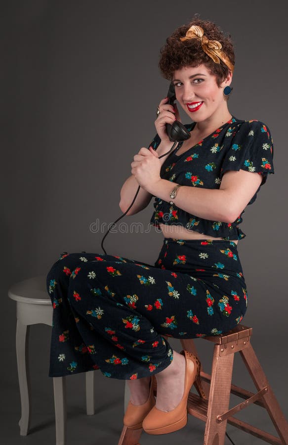 Pinup Girl in Flowered Outfit Bored on the Phone Stock Image - Image of ...