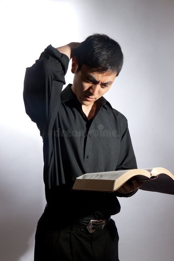 A pious Asian man stock photo. Image of bible, praying - 20357374