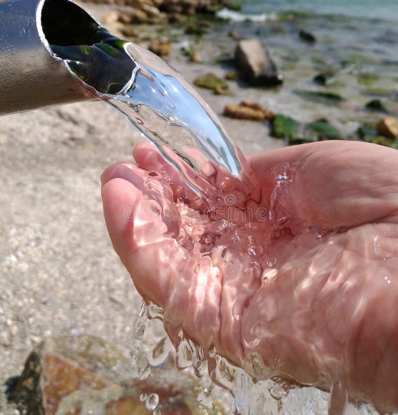 Pipe with Artesian Clean Water and a Hand Stock Image - Image of clean ...