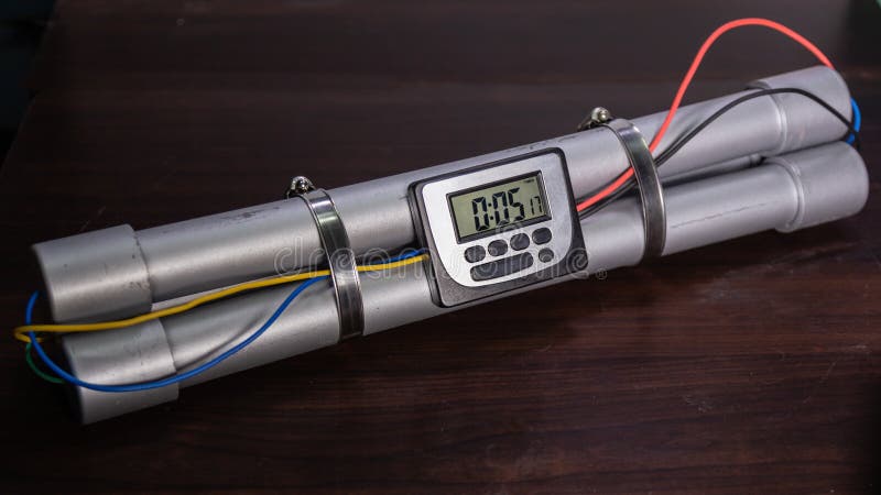 Pipe Bomb with an Clock Timer To Trigger Detonation, on Wooden Table ...