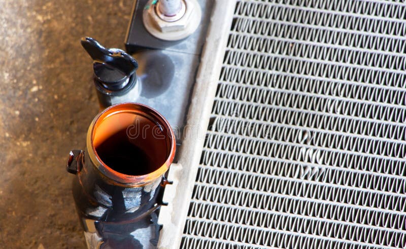 Pipe of Broken Car Radiator with a Rusty Color on a Concrete. Focus on ...