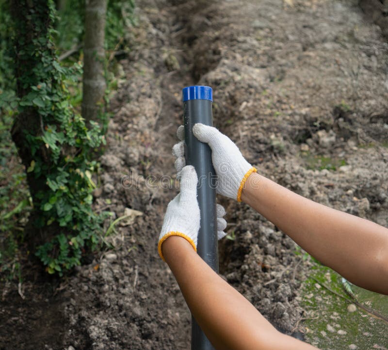 Pipe Contractor Install New HDPE Pipes Under the Ground. Stock Photo ...