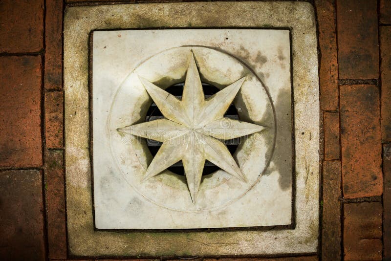 The pipe cover on the star stock image. Image of pavement - 161250835