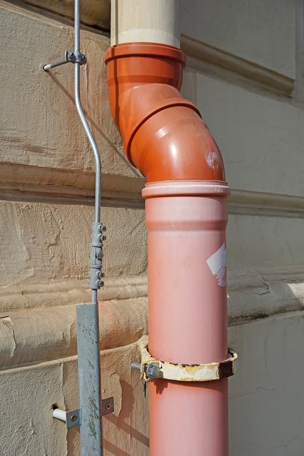 Pipe of the Eaves Next To the Wall of a Building Stock Image - Image of ...
