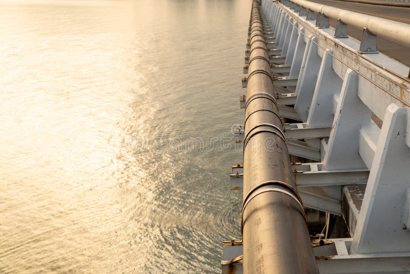 Pipe is Installed Along the Bridge on the Pipe Support Stock Image ...