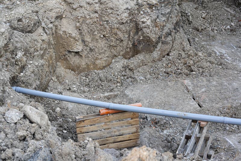 Pipe laying in the ground stock image. Image of underground - 189662467