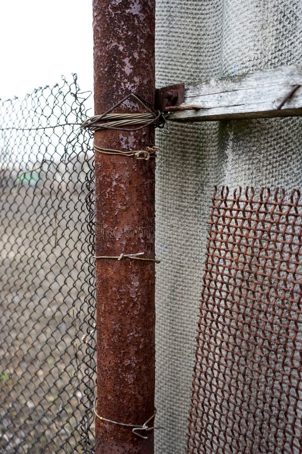 Pipe and Old Rusty Fence Mesh and Slate Stock Image - Image of prison ...