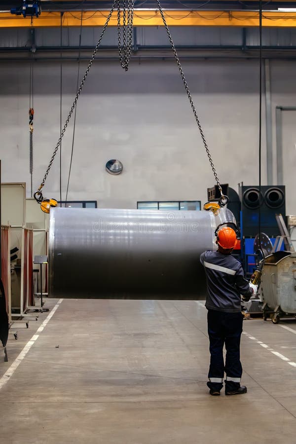 Pipe on Overhead Crane. Worker with Remote Control Stock Image - Image ...