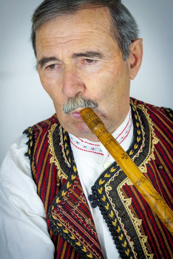Pipe Player in Traditional Clothing Stock Image - Image of toned ...