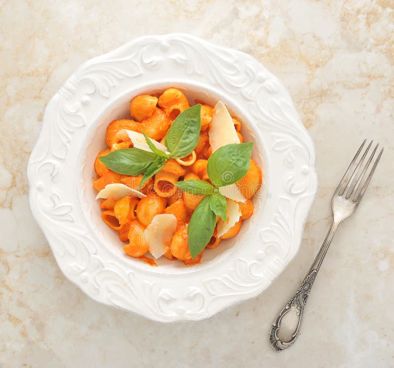 Pipe Rigate Pasta with Cheese, Basil and Pine Nuts Stock Photo - Image ...