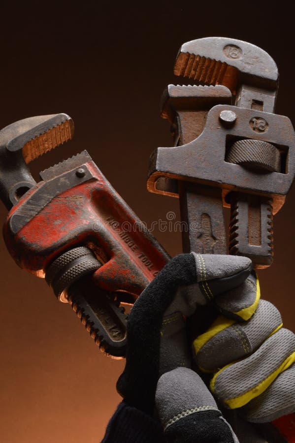Pipe Wrenches in Hand of Workman Stock Image - Image of wrenches ...