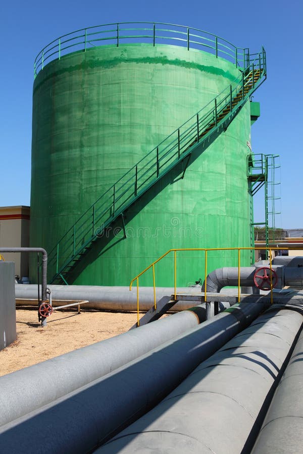 Pipeline and storage tanks stock photo. Image of pipeline - 23958706