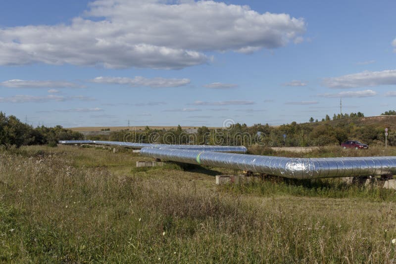 Pipelines through a field stock photo. Image of business - 26848196