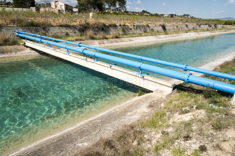 Pipes Above the Water Channel Stock Image - Image of industrial, pipes ...