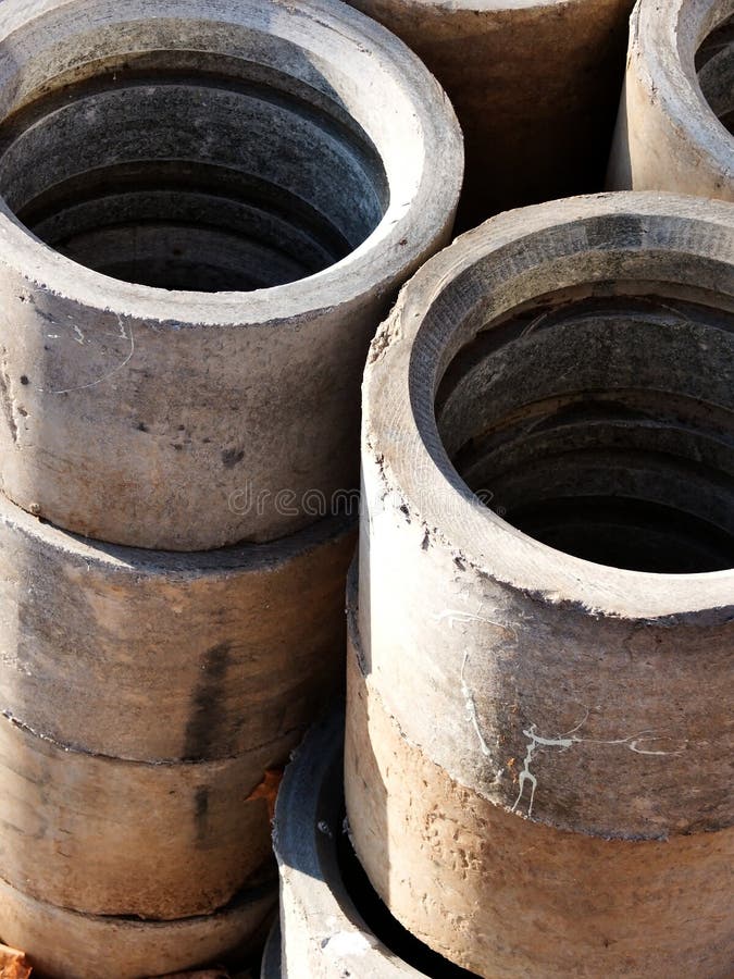 Pipes Cement Stack Warehouse Stock Image - Image of sunlight, cement ...