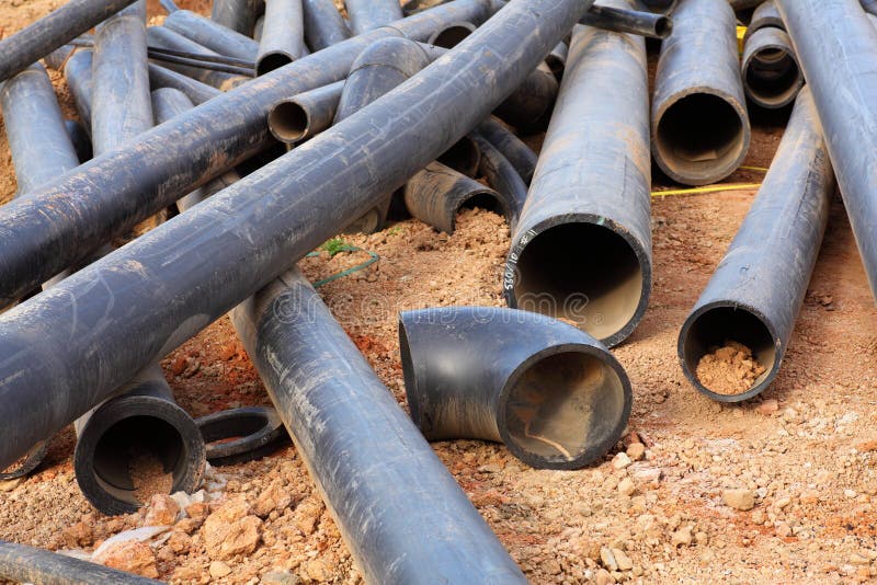 Polymer Pipes Cluttered on Dry Soil Stock Image - Image of messy ...