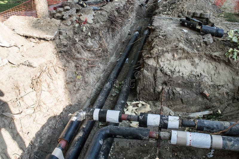 Pipes in the Earthen Trench for Heating System Stock Photo - Image of ...