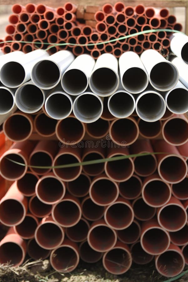 Stack of PVC pipes stock photo. Image of drainage, maintenance - 233974590